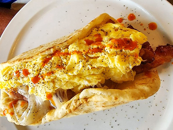 The breakfast sandwich that launched a thousand morning commutes—fluffy eggs and crispy bacon nestled between perfectly toasted bread.