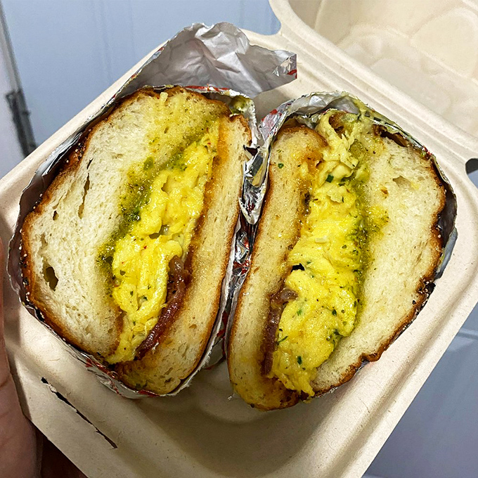 Breakfast sandwiches should always look this good—eggs and fillings peeking out like they know they're the stars of the morning show.