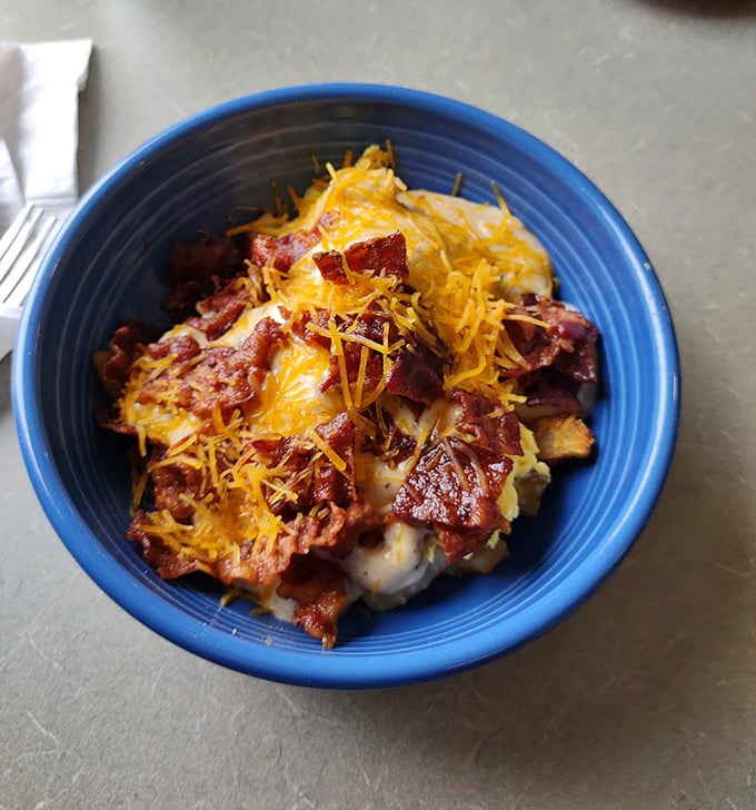 This breakfast bowl is what happens when comfort food gets a college degree—sophisticated yet approachable, with bacon playing the starring role.