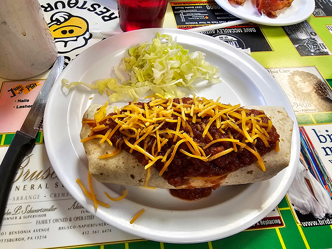 This breakfast burrito isn't messing around – packed with fillings and topped with enough cheese to make Wisconsin proud.
