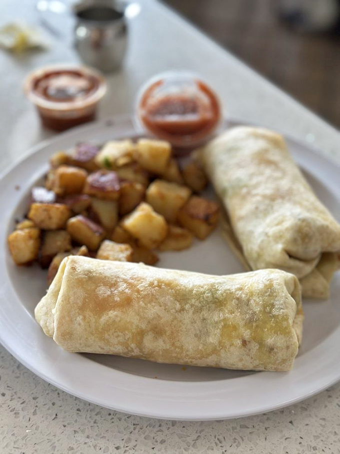 The breakfast burrito—nature's perfect food delivery system. Portable perfection with those crispy-edged potatoes that deserve their own fan club.
