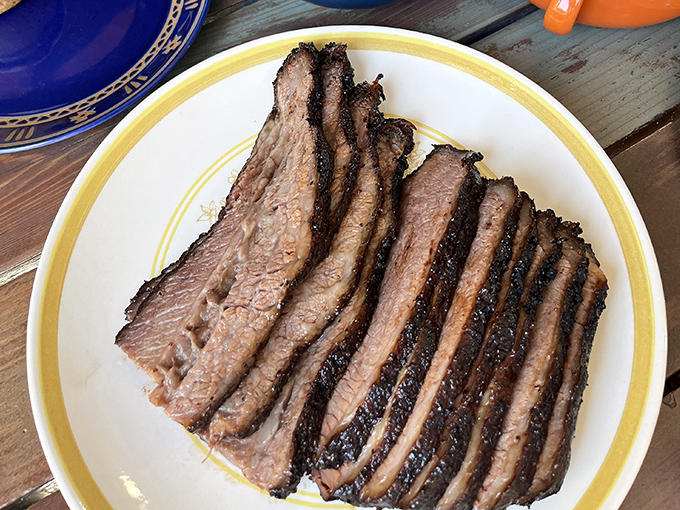 Brisket sliced with the precision of a surgeon and the reverence of a priest. The bark alone deserves its own fan club.