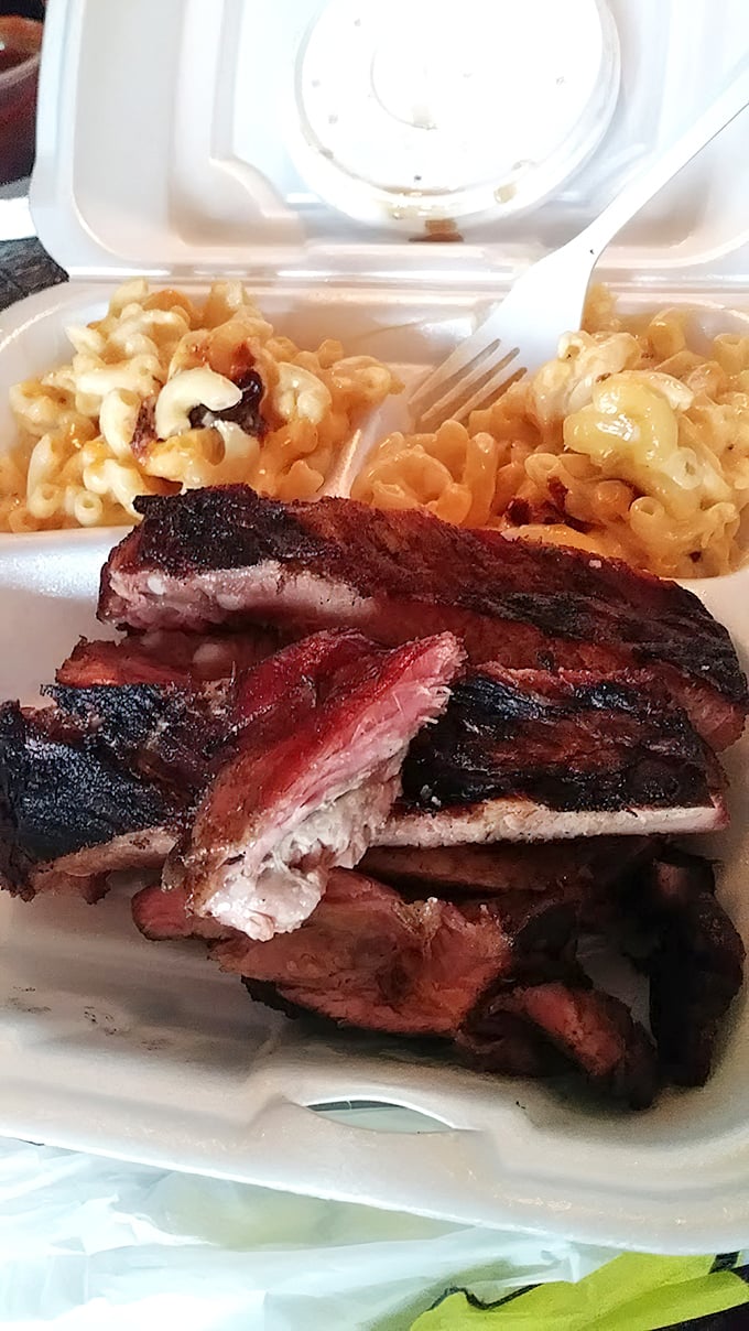 Brisket with a smoke ring so perfect it could be framed. The sauce doesn't hide the meat—it celebrates it.