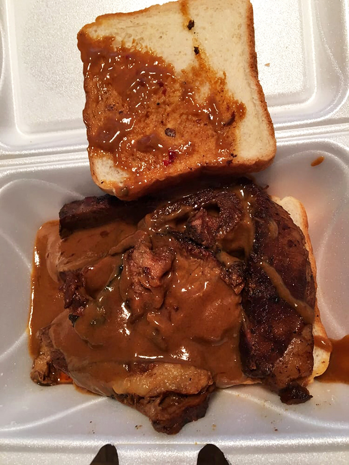 When sauce cascades down a brisket sandwich like this, napkins become both essential tools and eventual trophies of a battle well-fought.