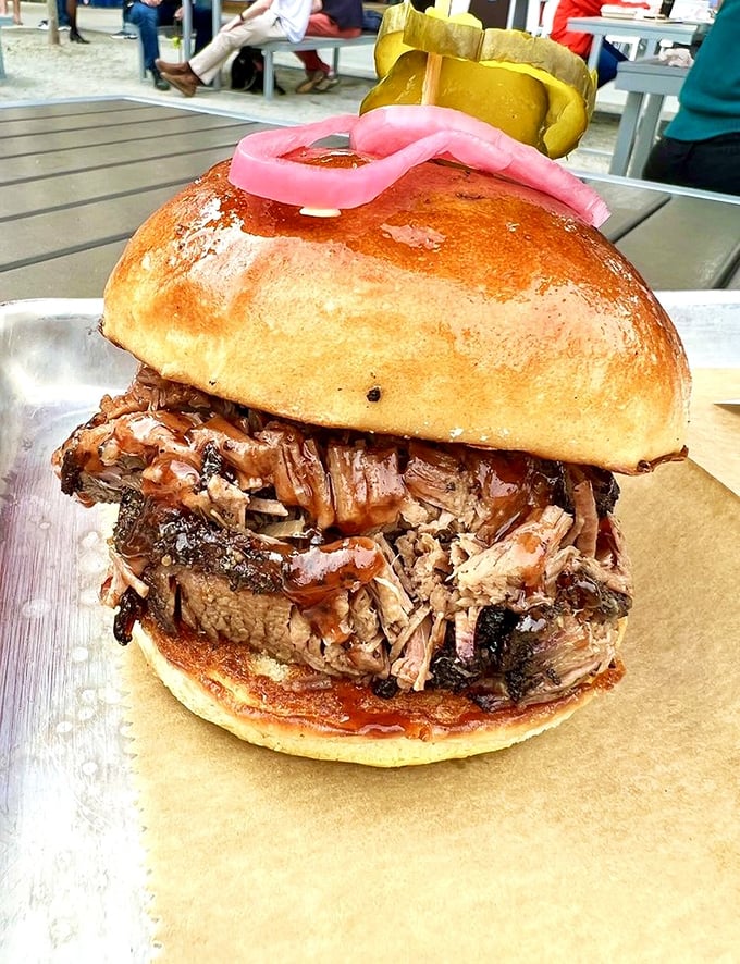 A pulled pork sandwich that requires what locals call "the BBQ lean"—that instinctive posture to keep the delicious evidence off your shirt. 