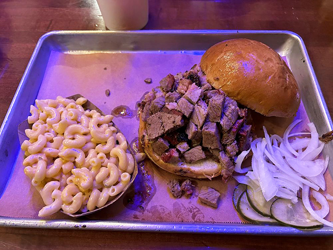 This isn't just a sandwich—it's an architectural marvel of meat. The tri-tip masterpiece with mac and cheese that makes cardiologists weep. 