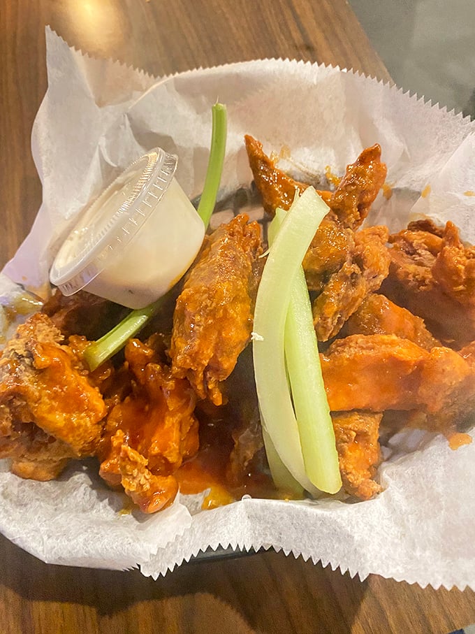 Buffalo wings that don't whisper heat—they announce it proudly with crispy edges and that unmistakable orange glow of promise.