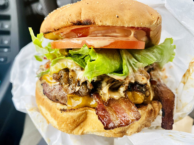 The bacon cheeseburger comes fully loaded with fresh veggies and a perfectly charred patty – proof that sometimes the classics need no improvement.