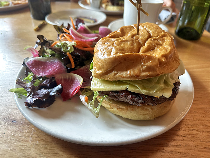 A burger that demands to be photographed before eaten—though your patience will be tested when those aromas hit your nose.