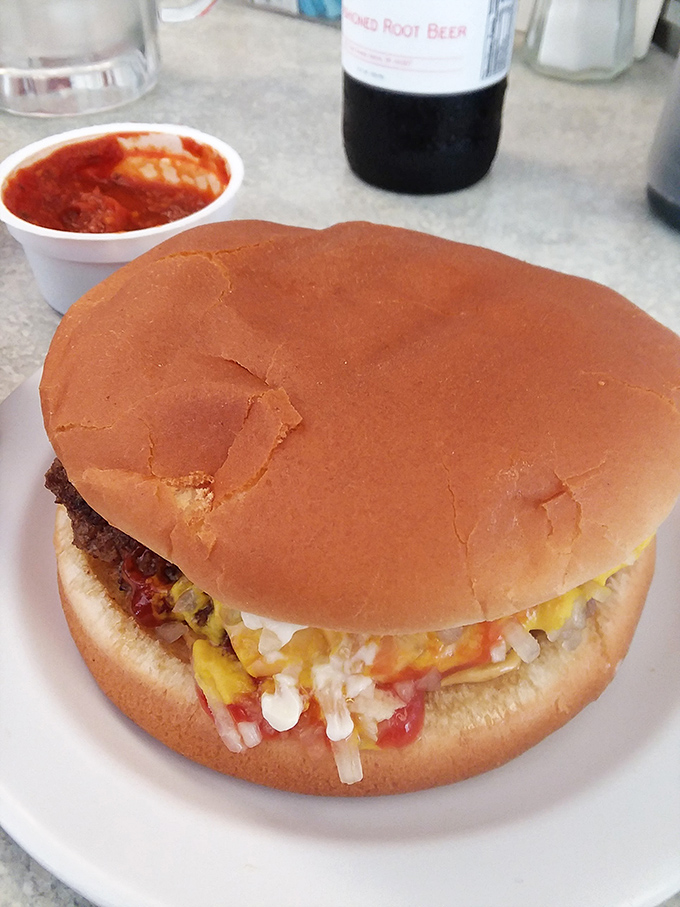 This isn't just a burger—it's edible evidence that simplicity, when executed perfectly, beats complexity every time. The soft bun embraces its contents like an old friend.