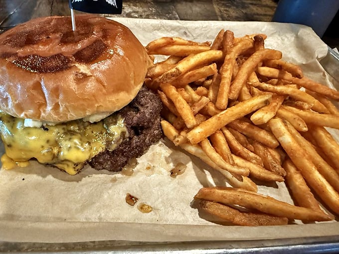 Even the burger gets the royal treatment—a juicy patty crowned with melted cheese alongside golden fries that demand to be devoured immediately.