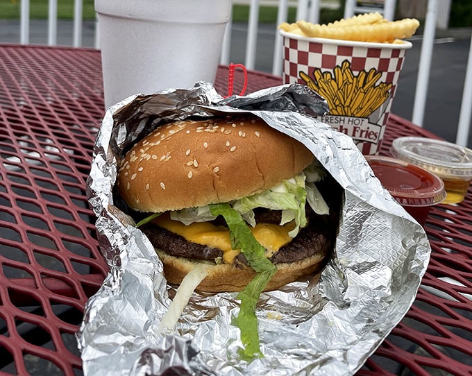 No foodie buzzwords needed here—just an honest-to-goodness burger wrapped in foil, waiting to remind you what hamburgers tasted like before they needed Instagram filters. 