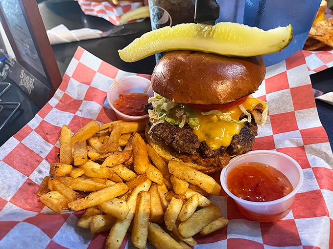 A burger that requires jaw exercises beforehand, complete with a pickle spear standing tall like a victory flag. This isn't fast food—it's slow, deliberate pleasure.