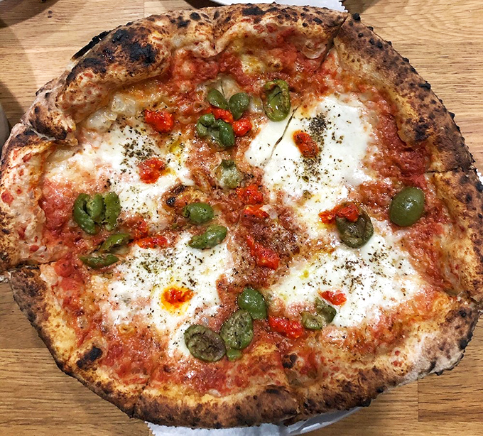 This burrata pizza is pure fire—blistered crust, creamy pockets of cheese, punchy green olives, and just the right heat from Calabrian chilies. Bestia knows exactly what it’s doing.