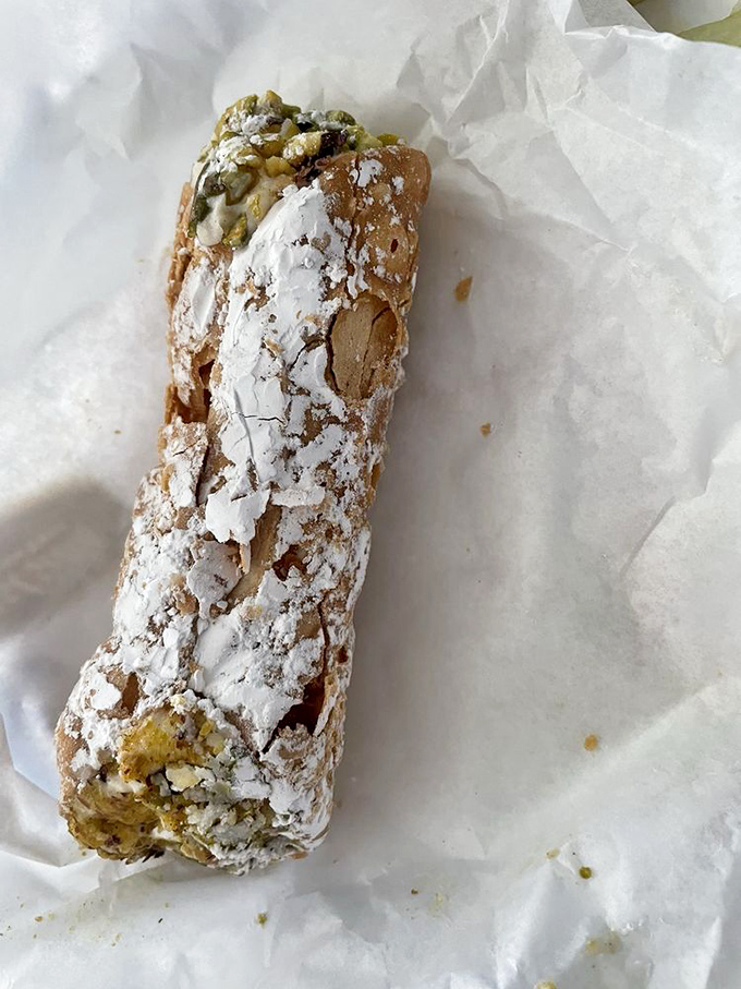 Not all heroes wear capes—some wear powdered sugar. This cannoli, with its crisp shell and sweet filling, is the perfect finale to your deli adventure.