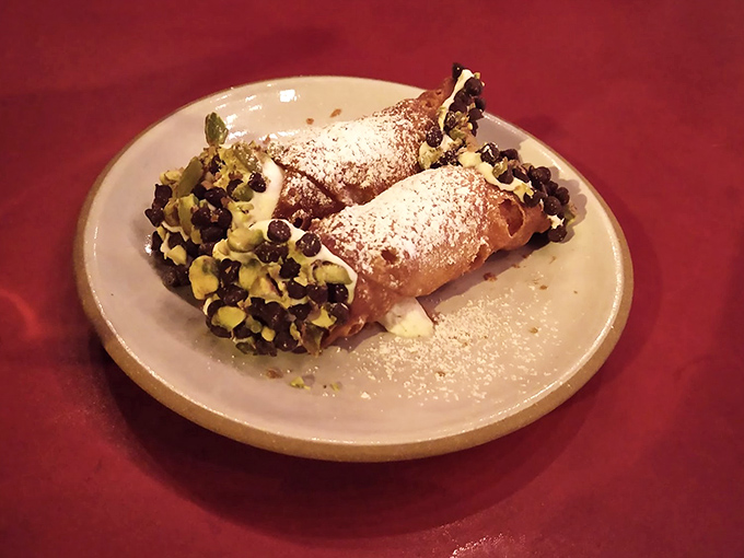 Cannoli that would make any Sicilian grandmother weep with joy – crisp shells, creamy filling, and that chocolate-pistachio finish.