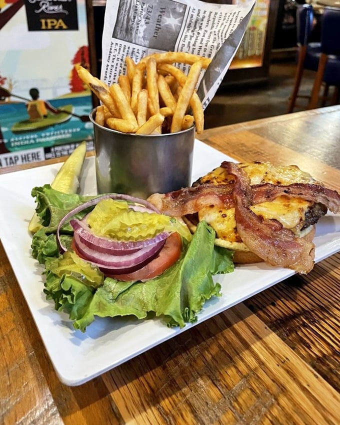 Crispy bacon, melted cheese, and a perfectly charred burger served with a side of golden fries—this is what burger dreams are made of, folks.