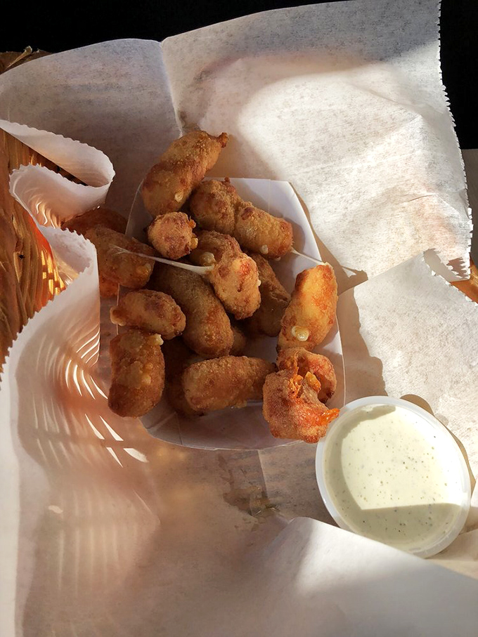 Wisconsin's favorite food group: cheese curds. Crispy outside, squeaky-melty inside, and that ranch dipping sauce is practically mandatory. 