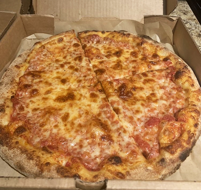 The classic cheese pizza—proof that sometimes the simplest things in life require the most expertise to perfect.