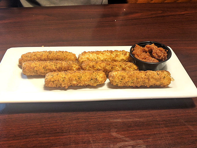 These golden-brown mozzarella sticks aren't your average appetizer – they're the overachievers of the fried cheese world, served with a dipping sauce worth fighting over.