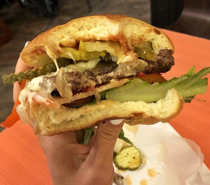 This isn't just a burger – it's a masterclass in balance. The pickle provides that perfect acidic counterpoint to the richness.