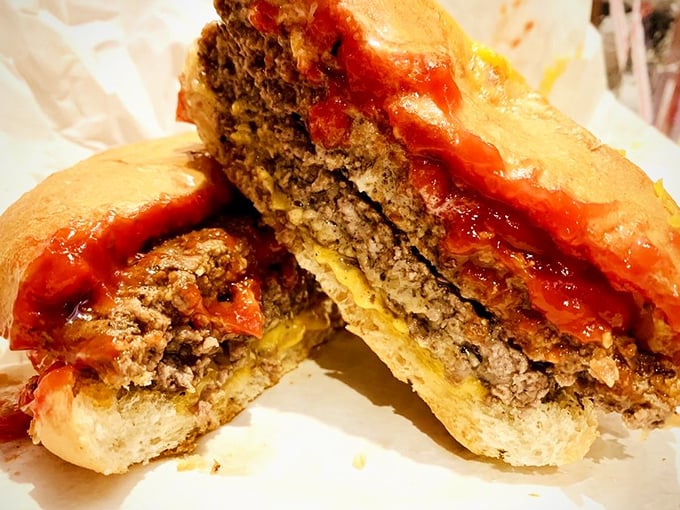 Behold the architectural wonder that is a proper Wisconsin burger—cheese melting into meat on a distinctive hard roll, a true regional treasure.