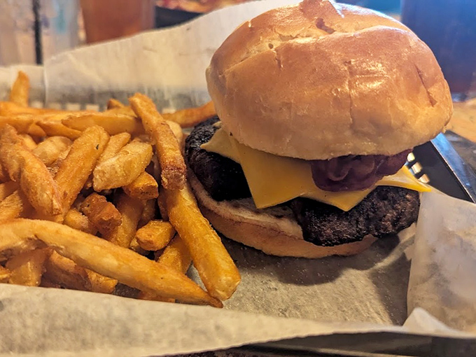 A burger that requires both hands and a strategy. Those golden fries aren't just a side—they're essential supporting players in this delicious drama.