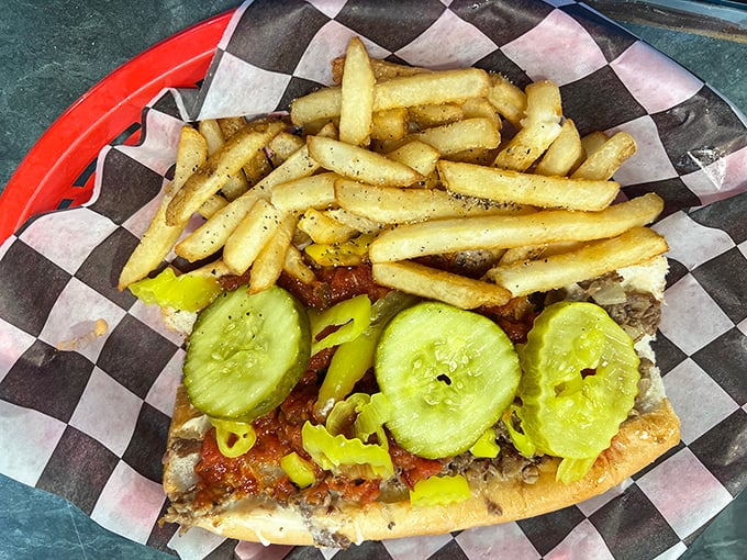 This isn't just a sandwich—it's an engineering marvel of meat, pickles, and fries that demands both your respect and your appetite.