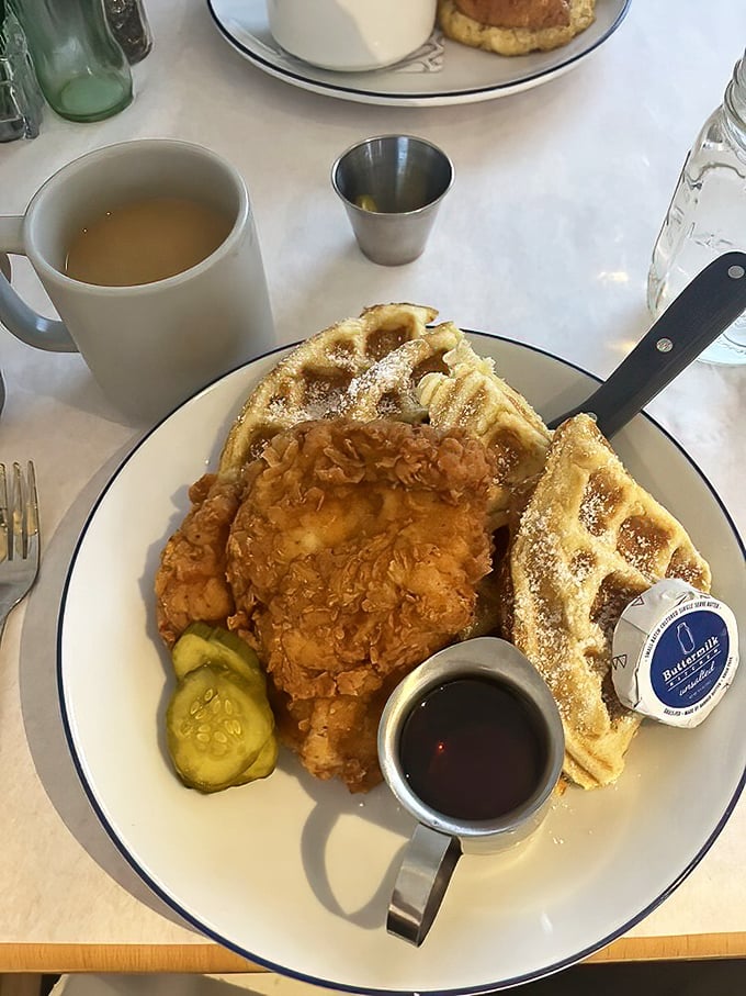 The chicken and waffles that launched a thousand road trips—golden fried perfection meets fluffy waffle with maple syrup standing by to mediate this perfect union.
