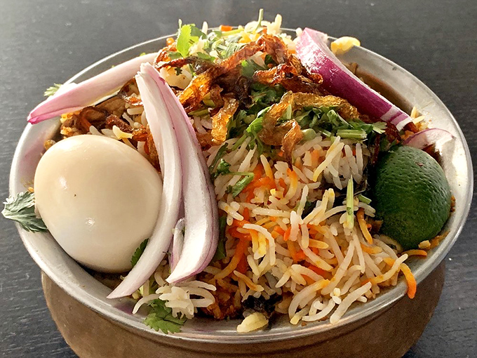Biryani with all the fixings – the hard-boiled egg and raw onions are like the backup singers that make the star shine even brighter.