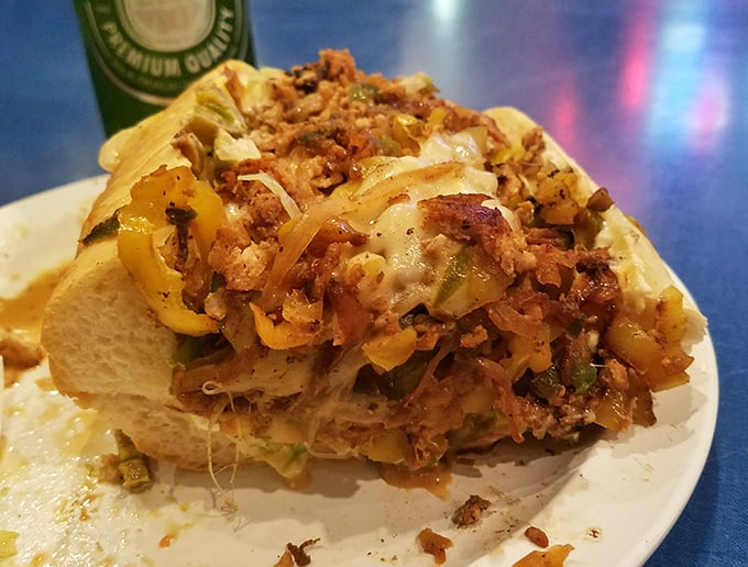 The chicken cheesesteak arrives looking like it's ready for its own Food Network special—a glorious mess of flavors that requires both hands and several napkins.
