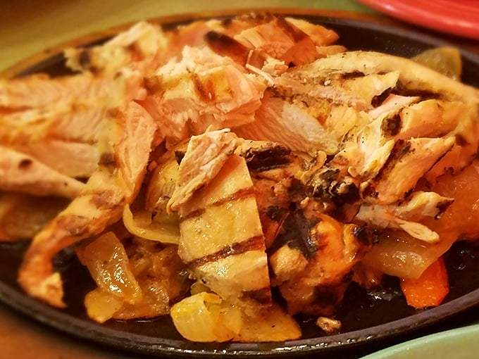 Chicken fajitas that don't just sizzle—they tell stories. Perfectly grilled with caramelized onions, they're the beach vacation your taste buds deserve.