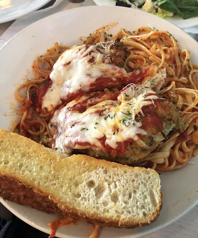 When pasta meets chicken parmesan at Hurricane Hanks, it's not just comfort food—it's like getting a warm hug from your Italian grandmother, even if you don't have one.