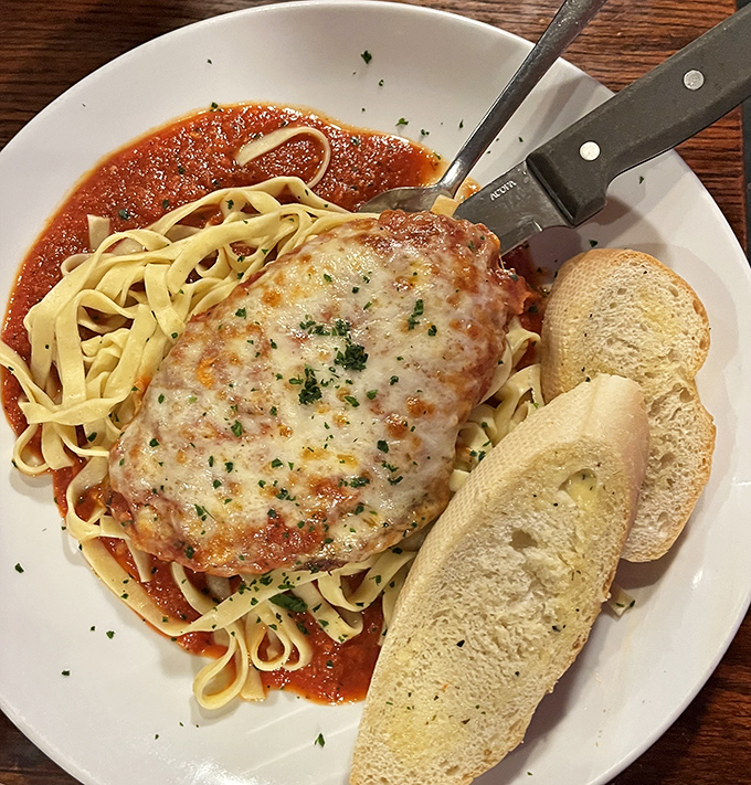 Chicken Parm done right – when the cheese blanket is this perfect, you know you're in capable culinary hands.