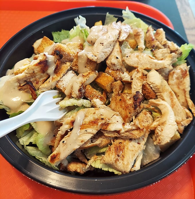 When you're trying to be "healthy" but still want flavor. Grilled chicken atop fresh greens with house dressing—the compromise that doesn't feel like one.