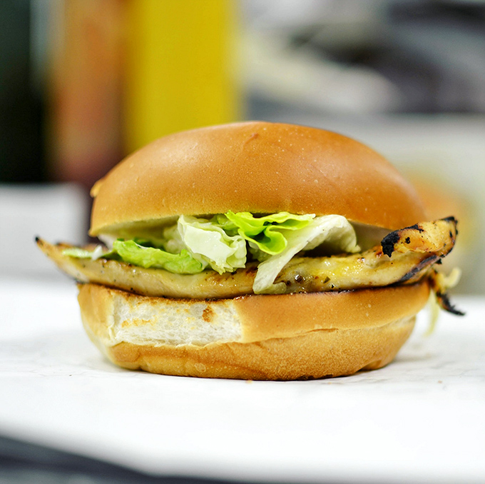 Not just any chicken sandwich – a proper grilled number with fresh lettuce that doesn't hide in a corporate kitchen but proudly shows its homemade roots.