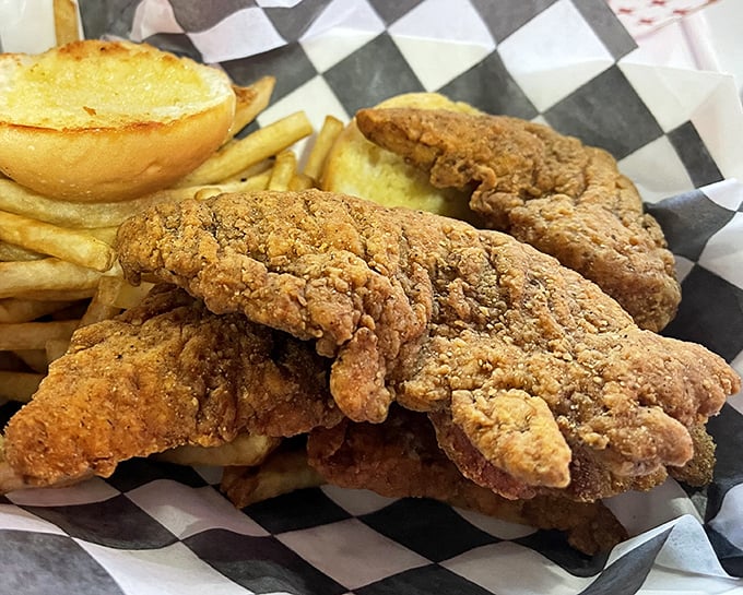 Golden-brown chicken tenders with a crunch you can hear across the room – proof that simple food done right is culinary poetry.