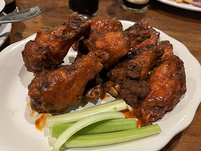 These wings aren't just crispy—they're the kind that make you temporarily forget table manners exist. Celery sticks provide the illusion of health.