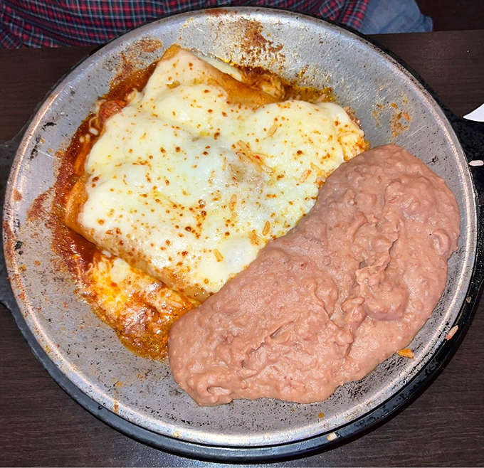 These enchiladas don't need fancy presentation to impress—they let the melted cheese and rich sauce do all the talking.