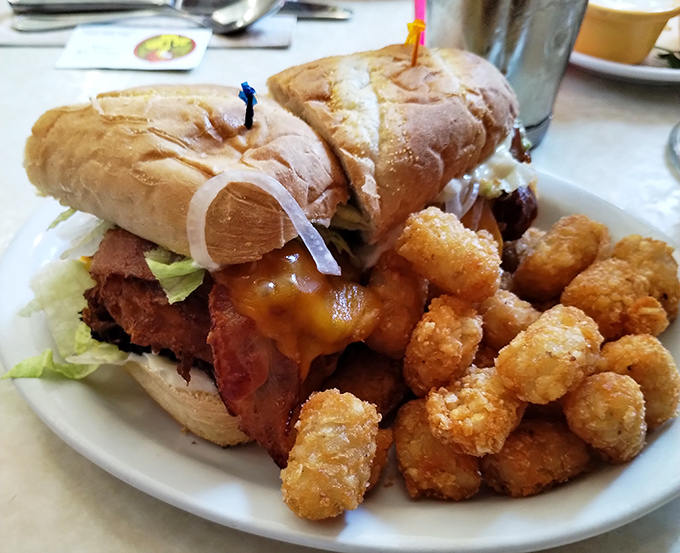 This isn't just a chicken sandwich—it's a monument to crispy perfection. Those tater tots are the backup singers this rock star deserves.
