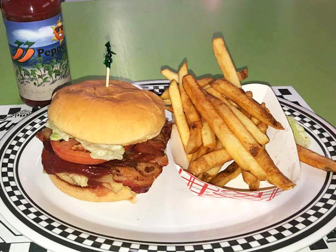A chicken sandwich that requires both hands and a strategy, flanked by fries standing at attention. This isn't fast food—it's good food that's worth the wait.