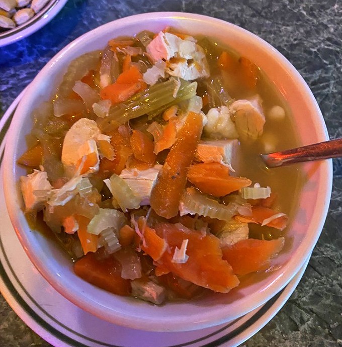 This isn't just chicken and noodles—it's a bowl of liquid comfort topped with shredded meat that makes you wonder why you'd ever settle for ordinary soup again.