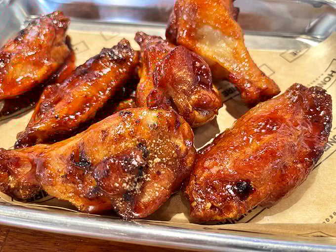 Wings that glow with a lacquered sheen of sauce – these aren't just wings, they're barbecue stained-glass windows.