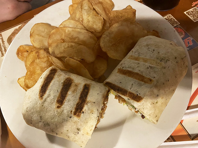 Crispy on the outside, tender within—this wrap and its potato chip sidekicks are the lunch heroes we all deserve but rarely find.