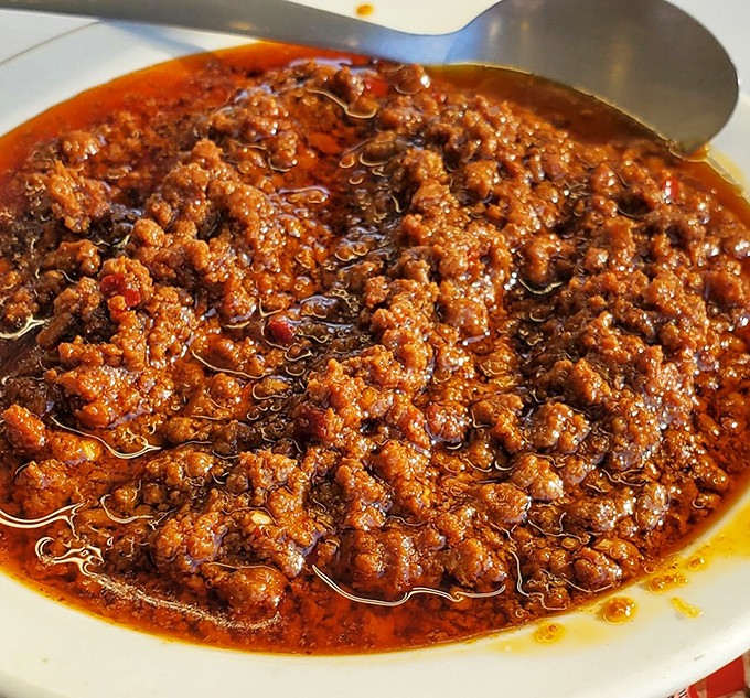 This isn't just chili—it's a spoonable meat symphony that's been simmering its way into Kansas City hearts for generations. Spoons up!