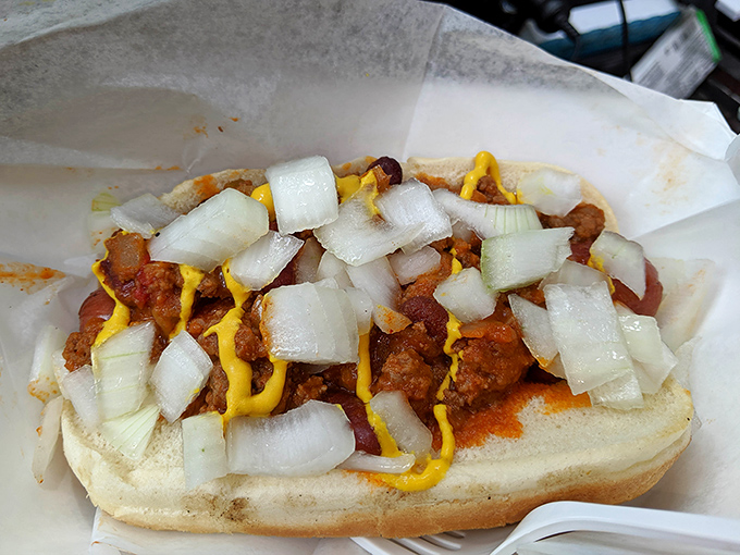 The Coney dog's midwestern cousin arrives loaded with chili, mustard, and onions—a beautiful mess worth every napkin you'll need afterward.