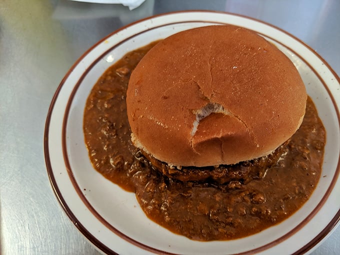 When a burger gets baptized in homestyle chili, something magical happens. This isn't just a sandwich – it's comfort in edible form.