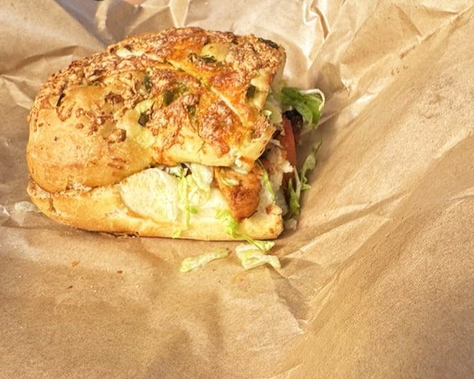 This sandwich isn't just served—it's presented, with house-made chips standing guard like crunchy sentinels of satisfaction.