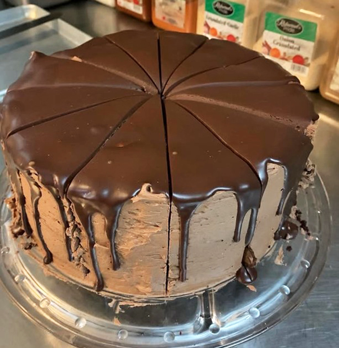Chocolate cake so decadent it should require a permission slip. That ganache drip isn't just for show—it's the formal attire this dessert wears to impress.