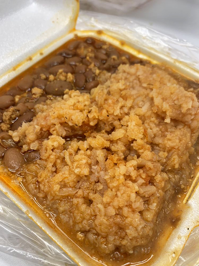 When beans and rice look this good, you know you're in the right place. That chorizo isn't just meat; it's a flavor bomb waiting to detonate.